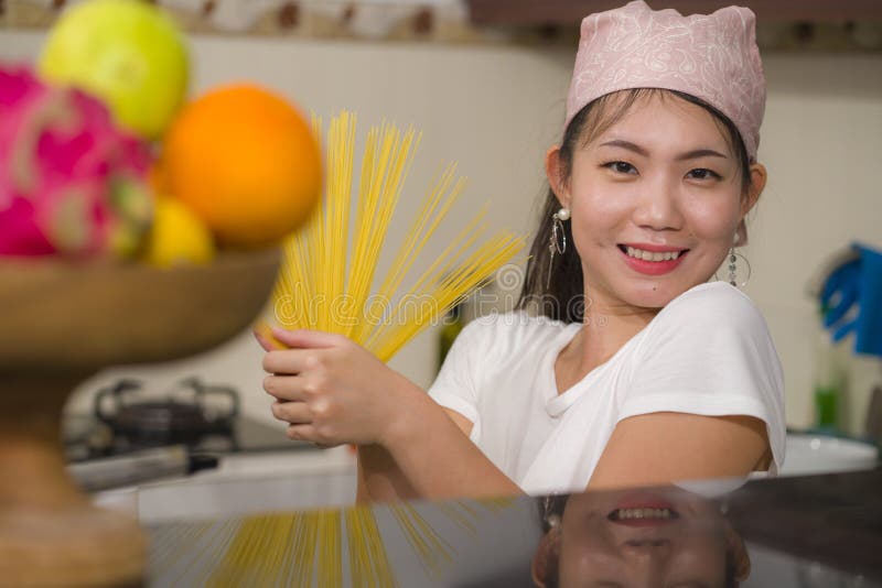 Attractive And Happy Asian Woman Preparing Noodles Domestic Lifestyle