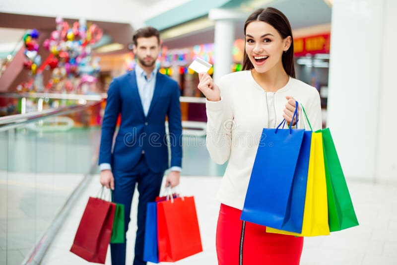 Attractive Happy Customers with Packets and Credit Card after Shopping ...