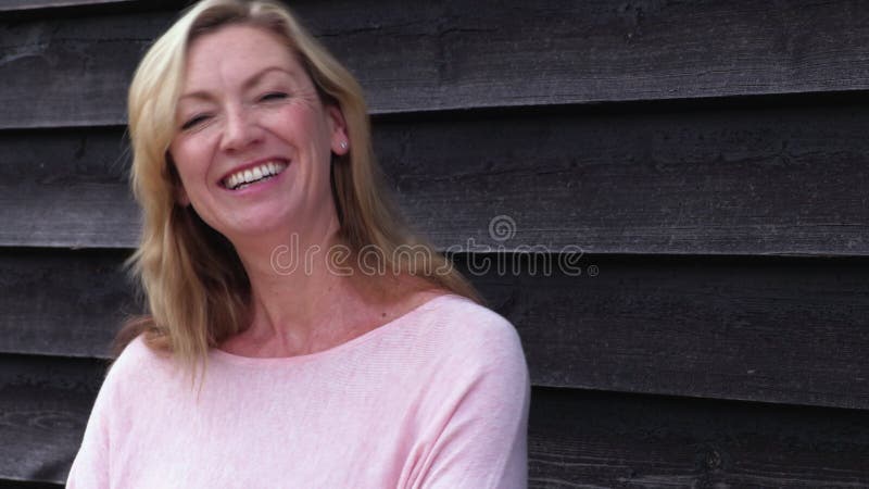 Attractive Happy Middle Aged Woman In Her Forties Outside Smiling And