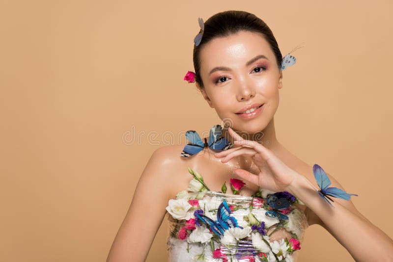 Smiling Naked Asian Girl In Flowers With Butterflies On Body Stock
