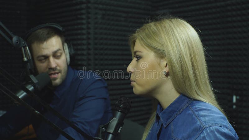 Attractive Happy Radio Host Interviewing a Guest in Studio Stock ...