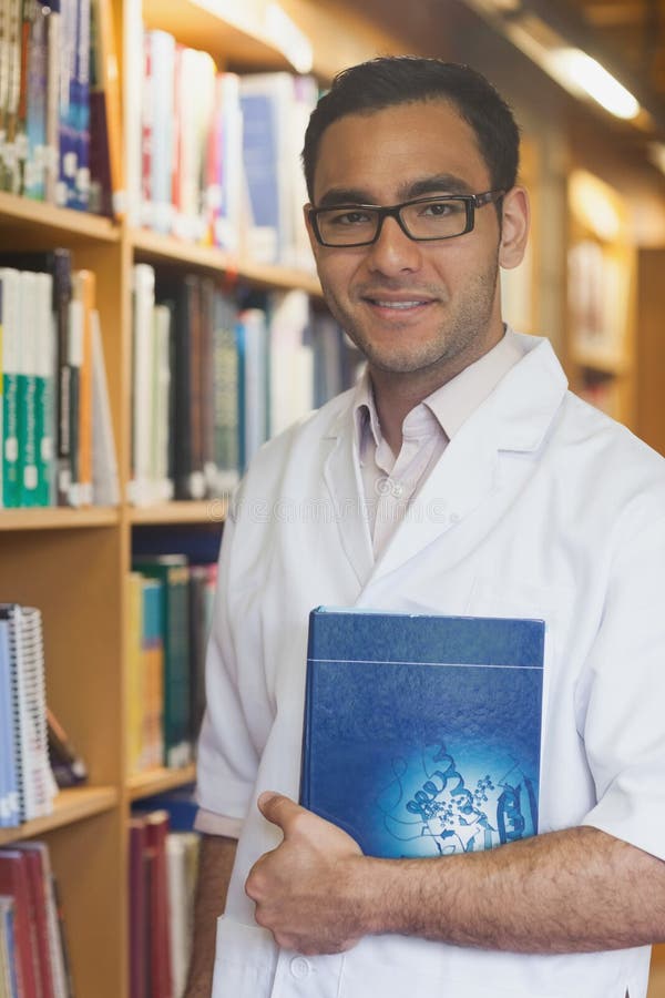 Attractive Intellectual Man Posing Library Holding Book Stock Photos ...