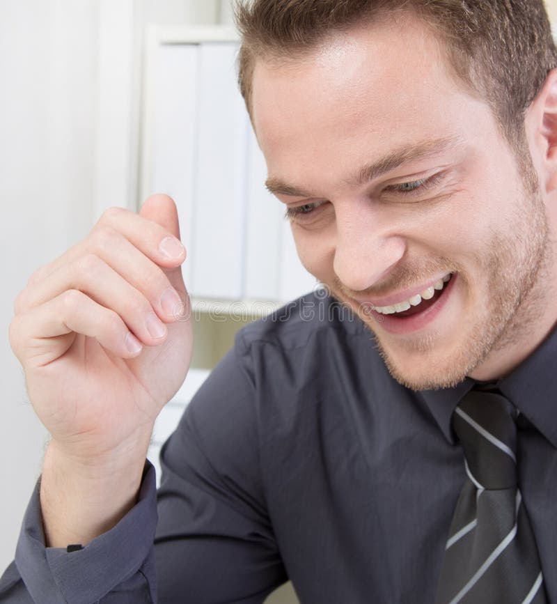 Attractive Laughing Businessman at Office Stock Photo - Image of person ...