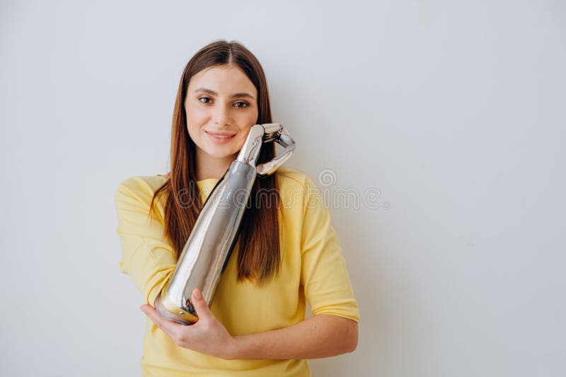 Portrait of a Beautiful Young Woman with a Bionic Prosthetic Arm in a ...
