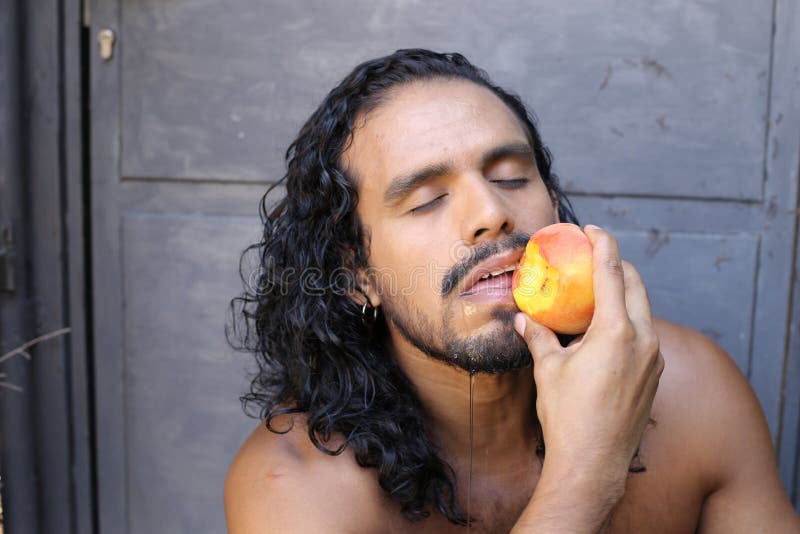 Attractive Long Haired Man Eating a Peach Stock Photo - Image of fruit ...
