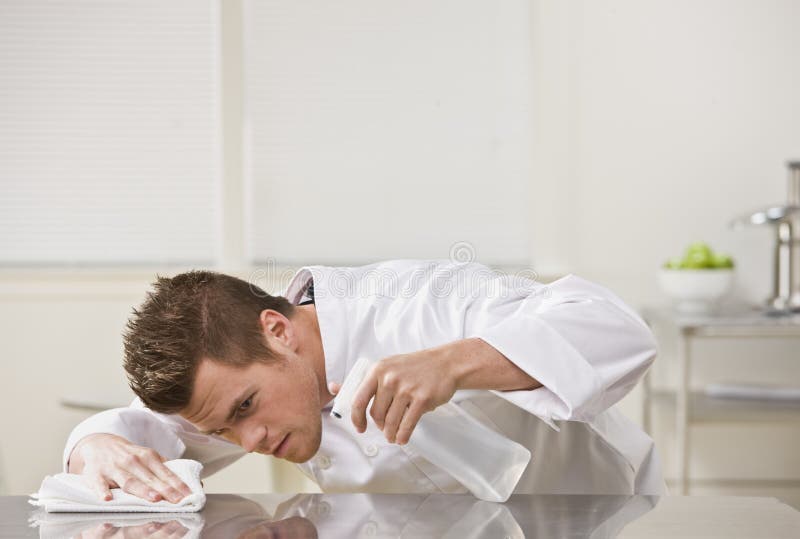 Attractive Male Cleaning Table. Stock Photo - Image of brunette ...