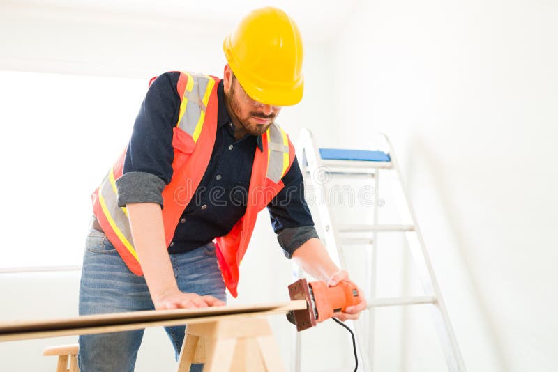 Hispanic Carpenter Lifting Roofing Panels Onto Roof Stock Image - Image ...