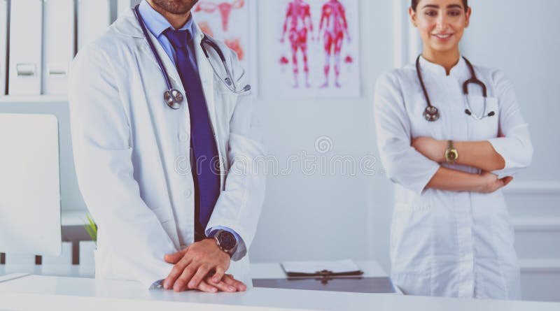 Attractive Male Doctor in Front of Medical Group Stock Image - Image of ...