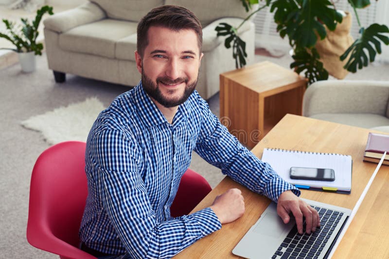 Attractive Male Sitting at Table and Working with Laptop Stock Image ...