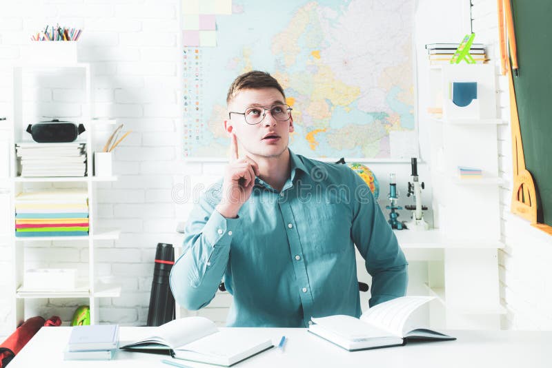 Attractive Male University Student Doing Some Homework in Class. Stock ...