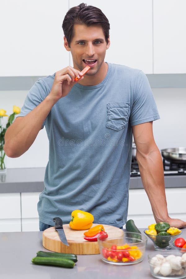 A Man Looking at the Slice of Pizza Stock Photo - Image of indoors ...