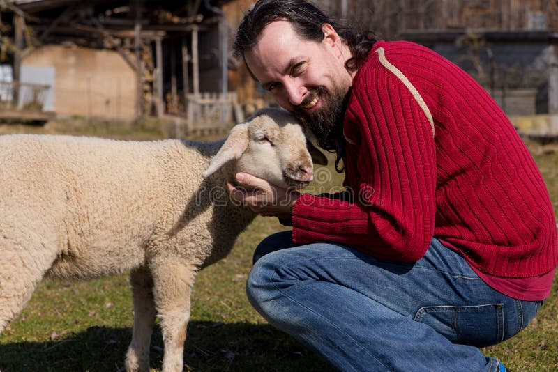 Attractive Man Hugging a Cute Lamb Stock Photo - Image of sanctuary ...
