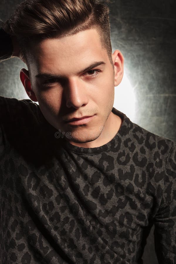 Attractive Man Posing while Fixing His Hair Stock Image - Image of ...