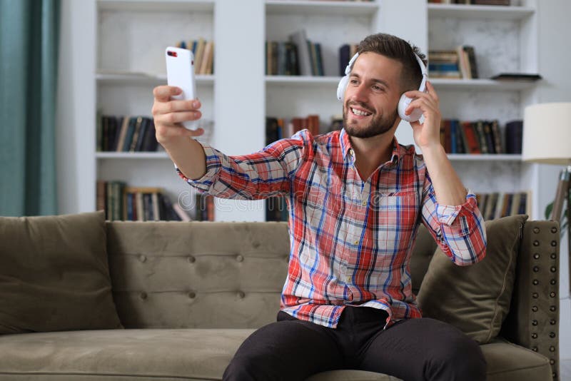 Attractive Man Taking Selfie Photo Or Self Video With Mobile Phone At