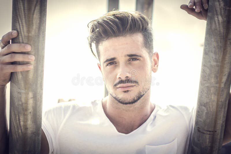 Man in Urban Setting in Front of Big Metal Structure Stock Image ...