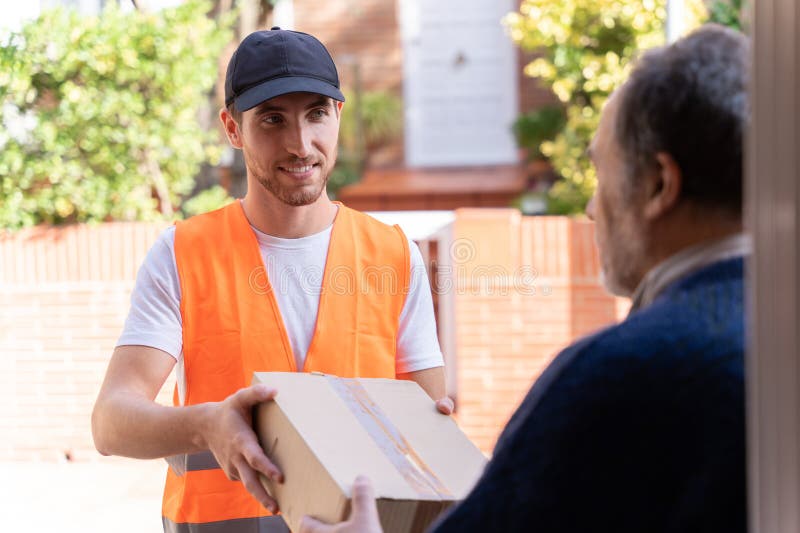 Attractive Man Working As a Delivery Man Delivers a Package To a ...