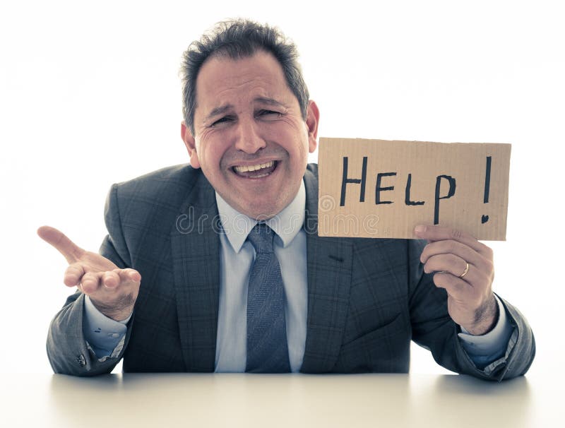 Attractive Mature Businessman Overwhelmed And Tired Holding A Help Sign