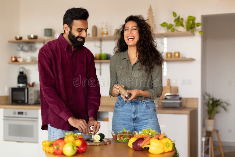 Attractive Middle Eastern Spouses Cooking Together at Home, Making ...