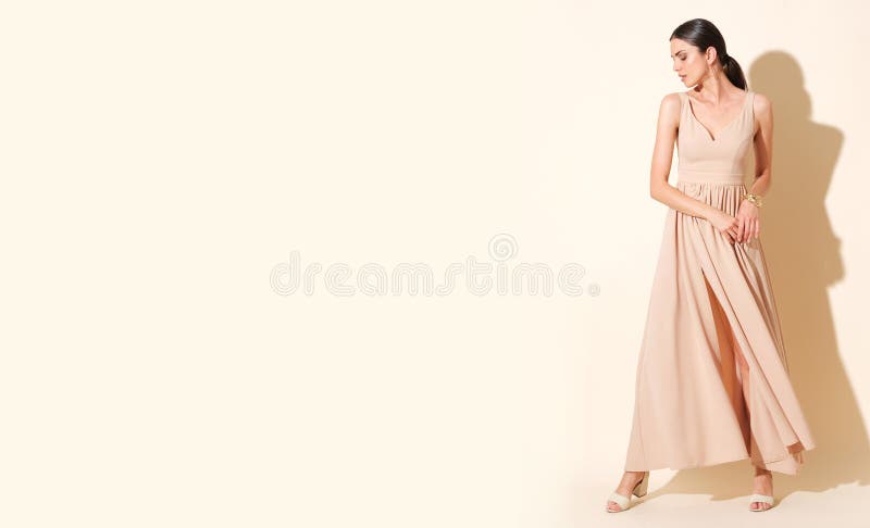 Attractive Model in Long Dress Posing in Studio. Stock Photo - Image of ...