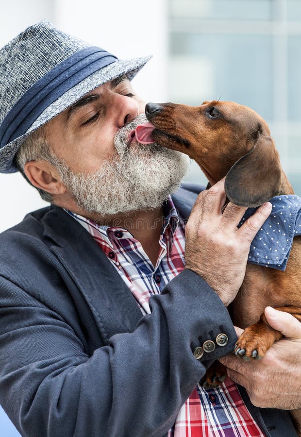 Attractive Old Man with Beard and Hat with Dog Teckel Stock Photo ...