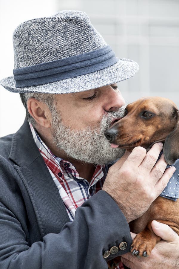 Attractive Old Man with Beard and Hat with Dog Stock Photo - Image of ...