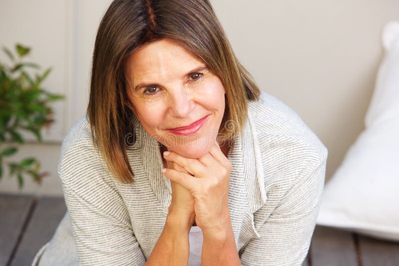 Attractive Older Woman Smiling And Sitting Outside Stock Image Image