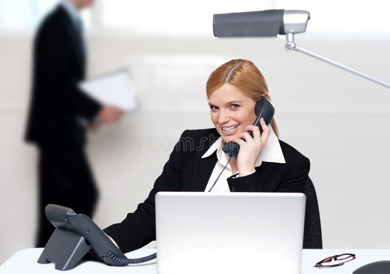 Attractive Secretary Attending Phone Call Stock Photo - Image of ...