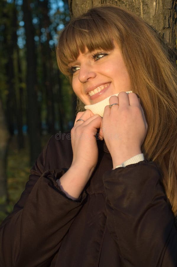 Attractive smiling girl stock image. Image of coat, adult - 11353335