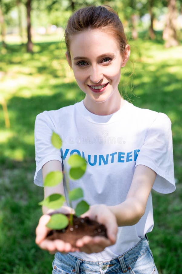 Attractive Smiling Volunteer Holding New Stock Photo - Image of smile ...