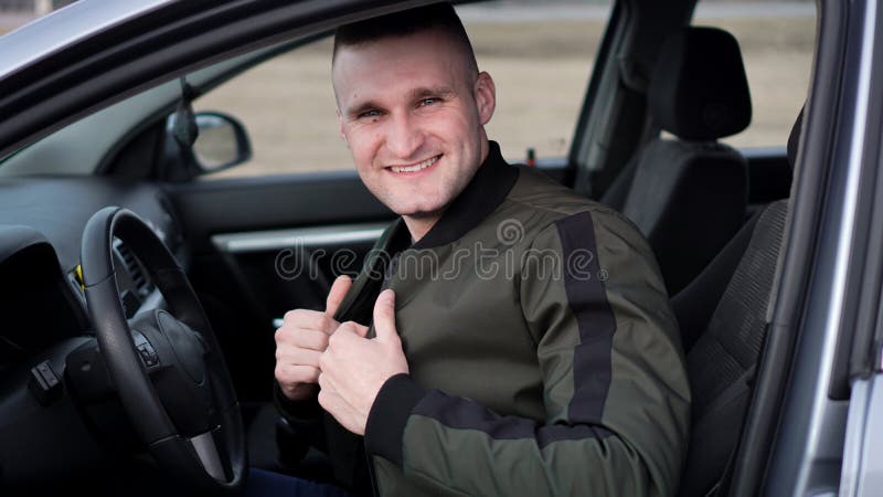 Attractive Smiling Young Man in a Car Stock Image - Image of happy ... Attractive Smiling Young Man in a Car Stock Image - Image of happy ...