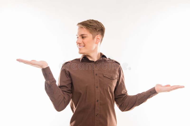 Attractive Smiling Young Man Choosing between Two Products Stock Image ... Attractive Smiling Young Man Choosing between Two Products Stock Image ...