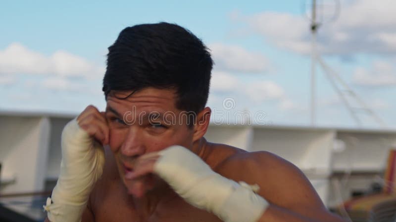 Attractive Strong Young Man Does Box Workout Exercising Shadow Boxing ...