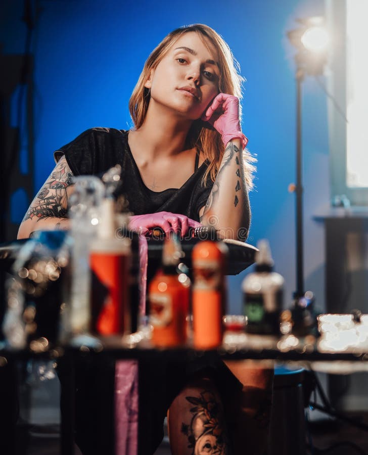 Attractive Tattoo Master with Serious Face Posing in Her Studio Stock ...