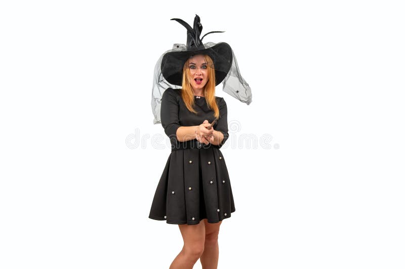 Attractive Witch Holding a Magic Wand and Casting a Spell with a ...