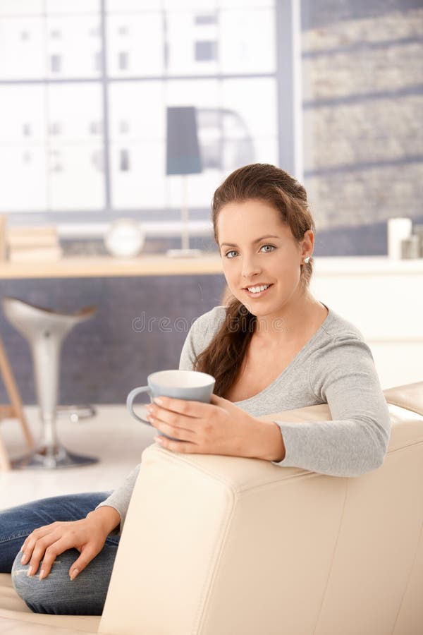 Attractive Woman Drinking Tea on Sofa Smiling Stock Photo - Image of ...