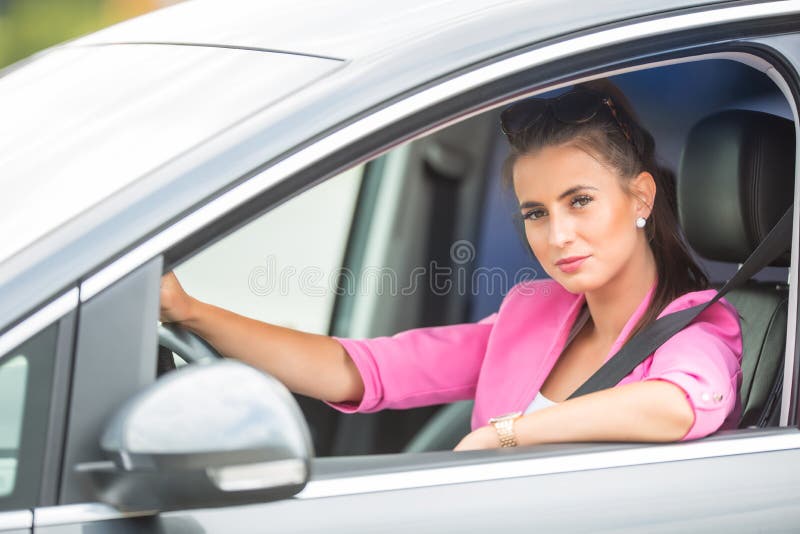 Attractive Woman Driving a Car with a Look Out Stock Image - Image of ...