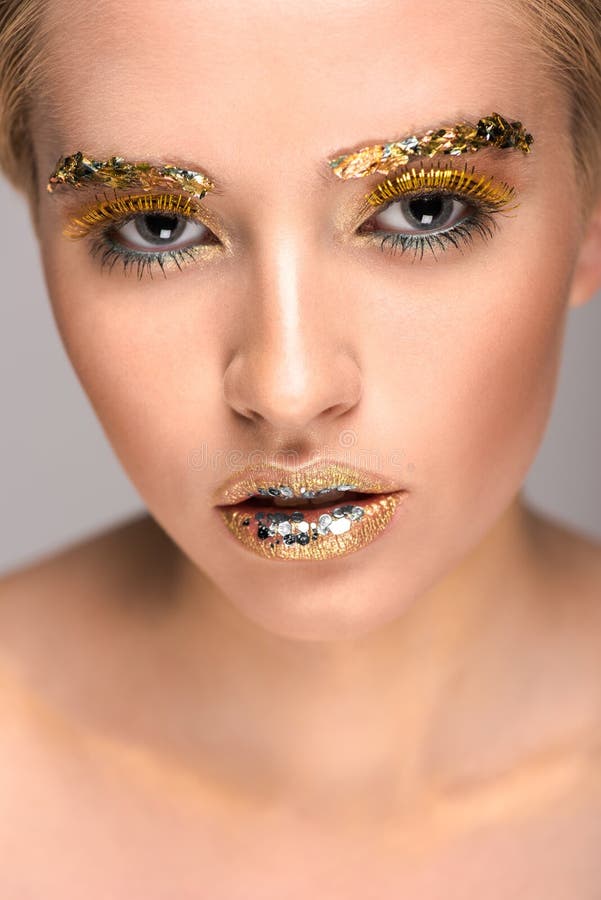 Attractive Woman with Golden Glitter on Face Looking Stock Image ...