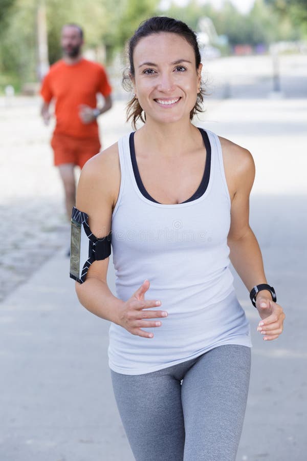 Attractive Woman Jogging Outdoors Stock Photo - Image of keepfit ...