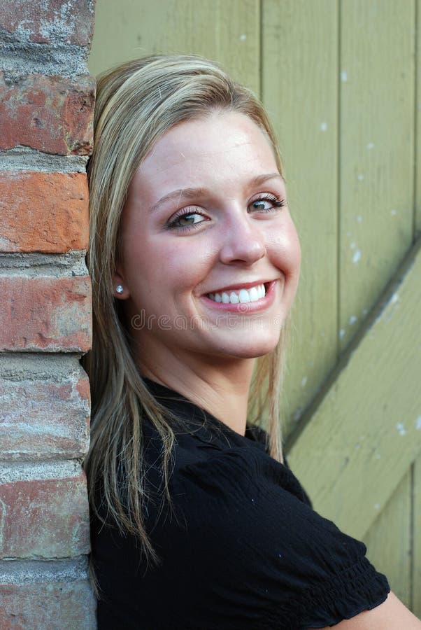 Attractive Woman Looking Side-Vertical, Smiling Stock Photo - Image of ...