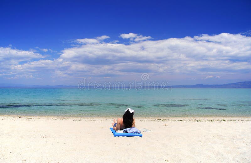 Attractive Woman Lying on the Beach Stock Photo - Image of pebble ...