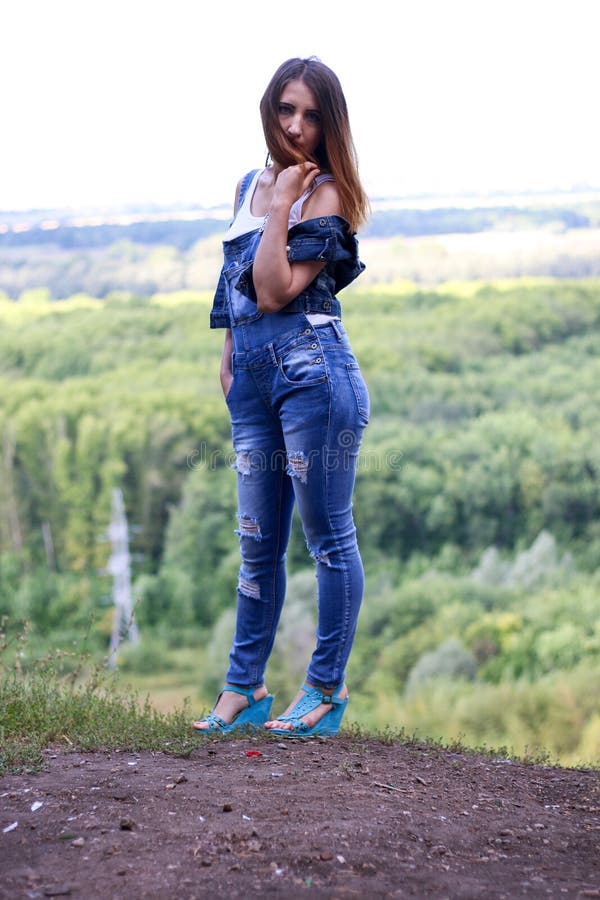 Attractive Woman Posing Against the Backdrop of Forest Stock Image ...