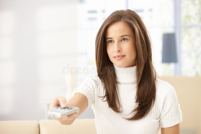 Attractive Woman with Remote Control Stock Photo - Image of casual ...