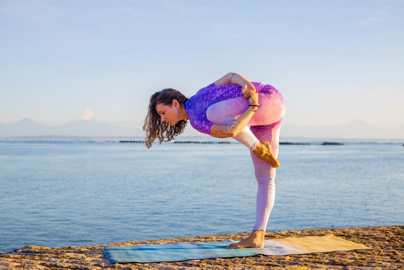 Attractive Woman Stretching And Preparing For Yoga Practice Sunrise