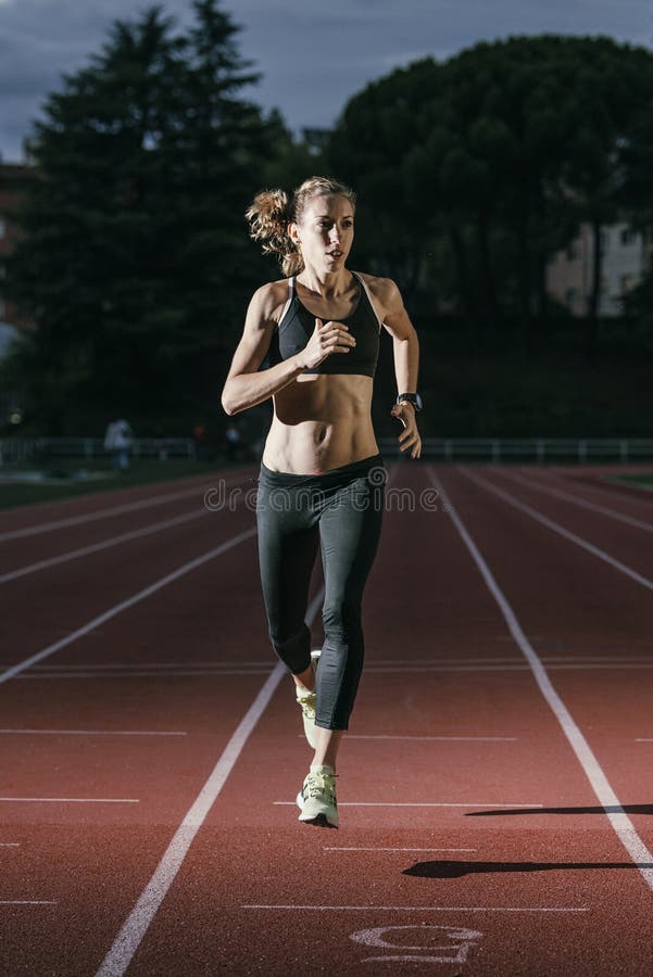 Attractive Woman Track Athlete Running on Track. Stock Image - Image of ...