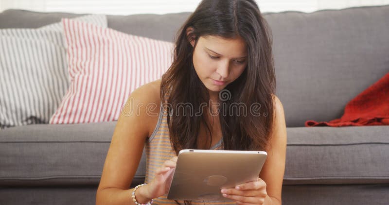 Attractive Woman Using Tablet at Home Stock Image - Image of floor ...