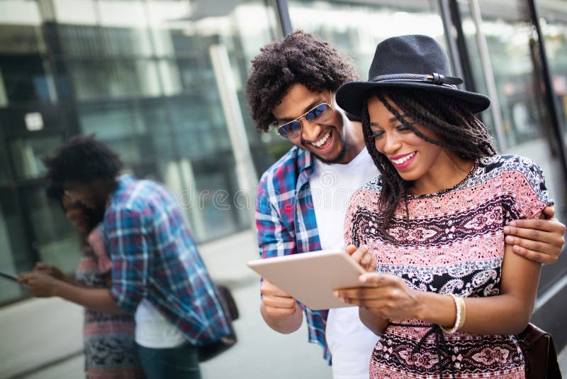 Attractive Young African Students are Using a Digital Tablet and ...