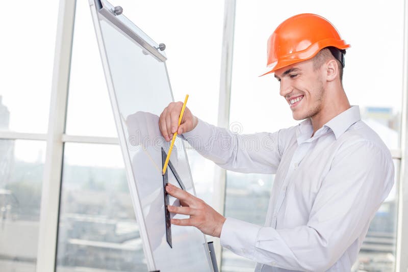 Attractive Young Architect is Working on Plan of Stock Photo - Image of ...