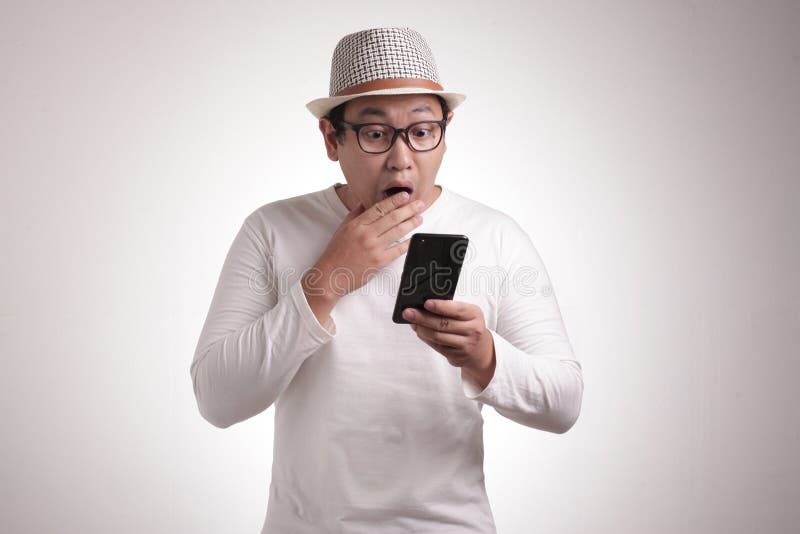 Young Man Texting Reading Chatting on His Phone Surprised Gesture Stock ... Young Man Texting Reading Chatting on His Phone Surprised Gesture Stock ...