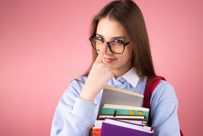 Attractive Young Blond College Student Holding Books in Her Hands with ...