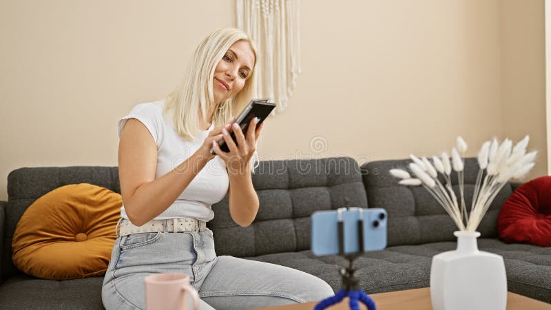 Attractive Young Blonde Woman Relaxing on Sofa at Home, Joyfully ...